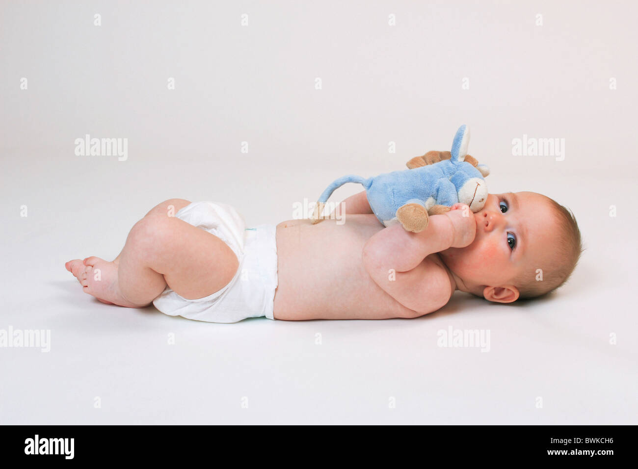 baby infant child diapers nappies recumbent lie lying soft toy soft toy ...