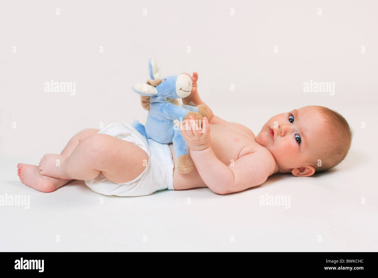 baby infant child diapers nappies recumbent lie lying soft toy soft toy ...