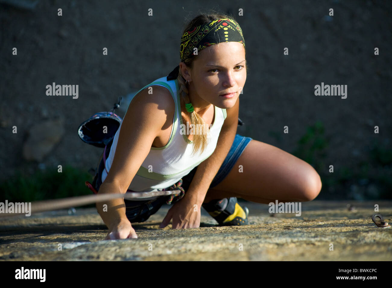 Image of female climber with rope climbing Stock Photo - Alamy