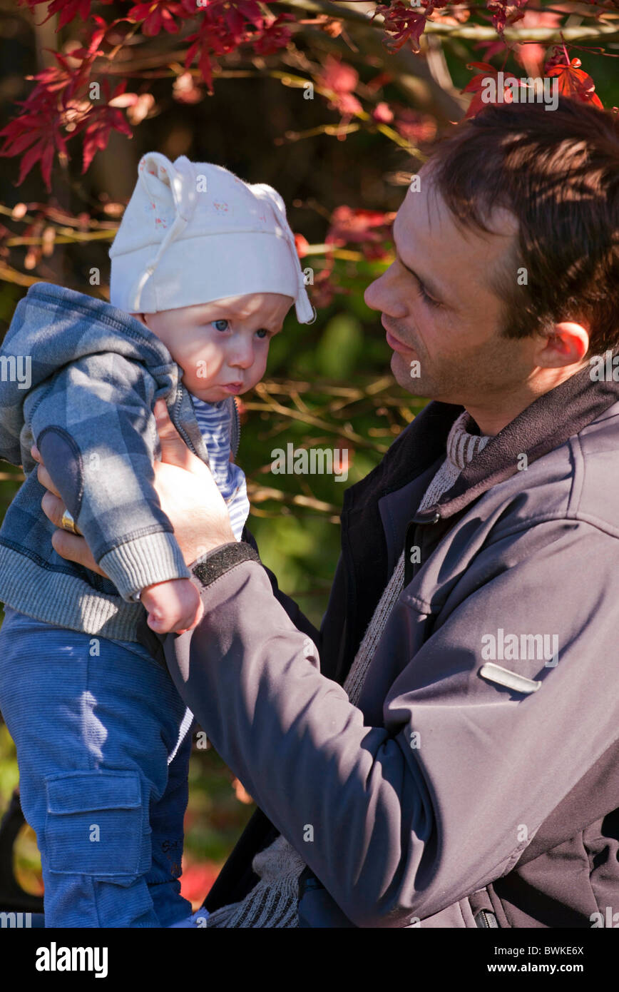 Father holding up his baby son Stock Photo - Alamy