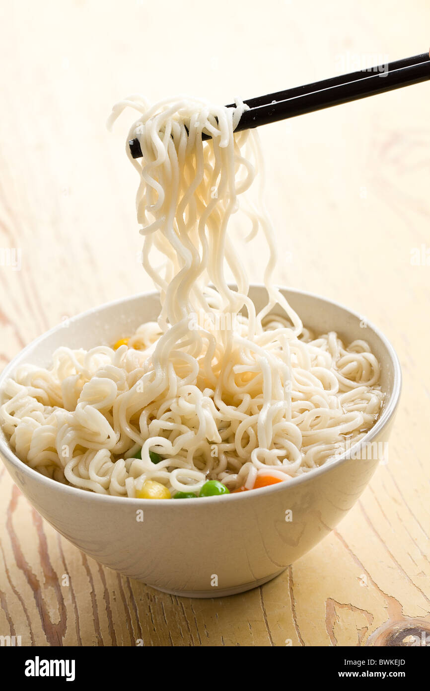 asian noodle soup on kitchen table Stock Photo - Alamy