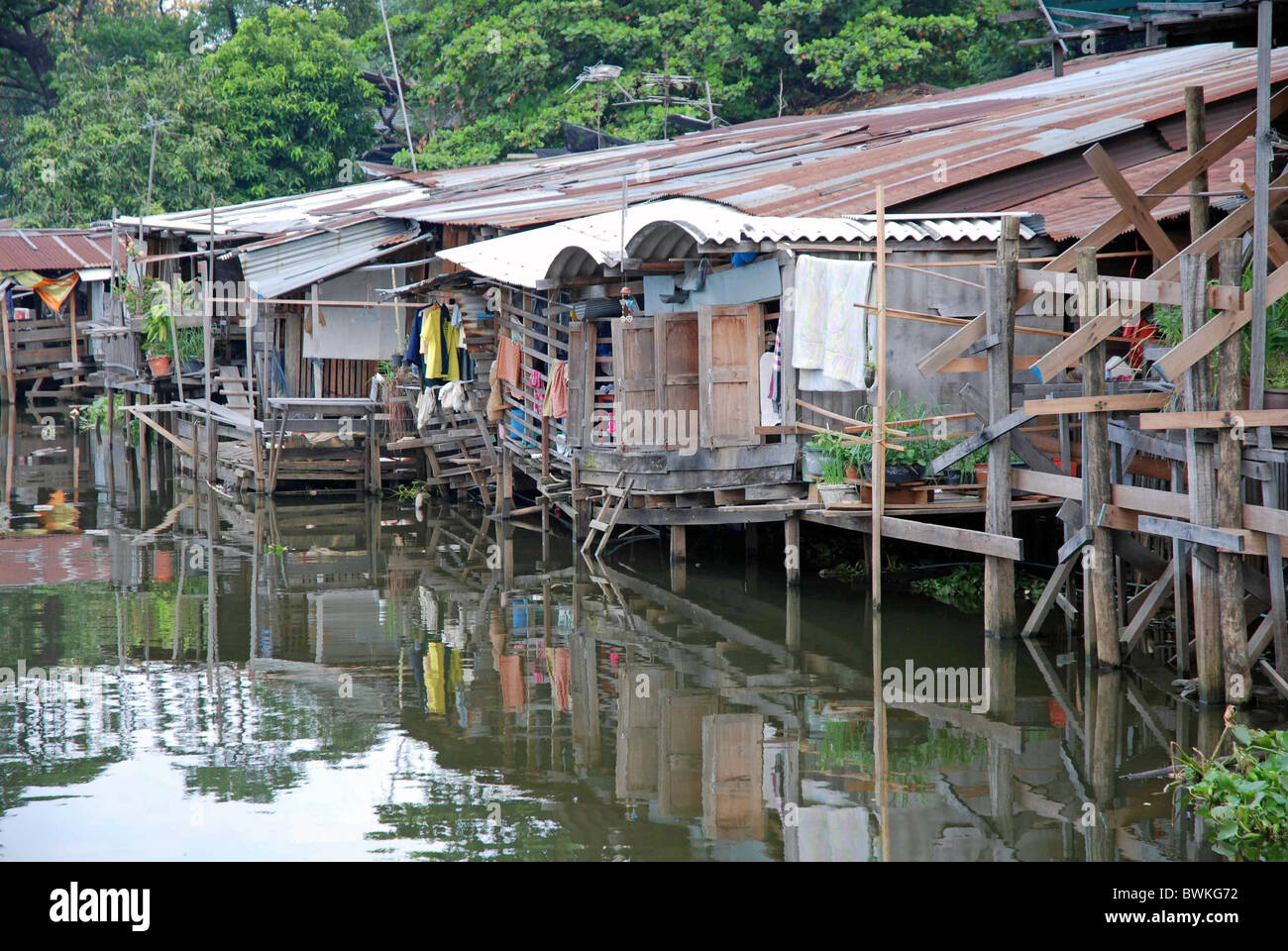 Chao Phraya river flow Bangkok slums slum poverty worker settlement ...