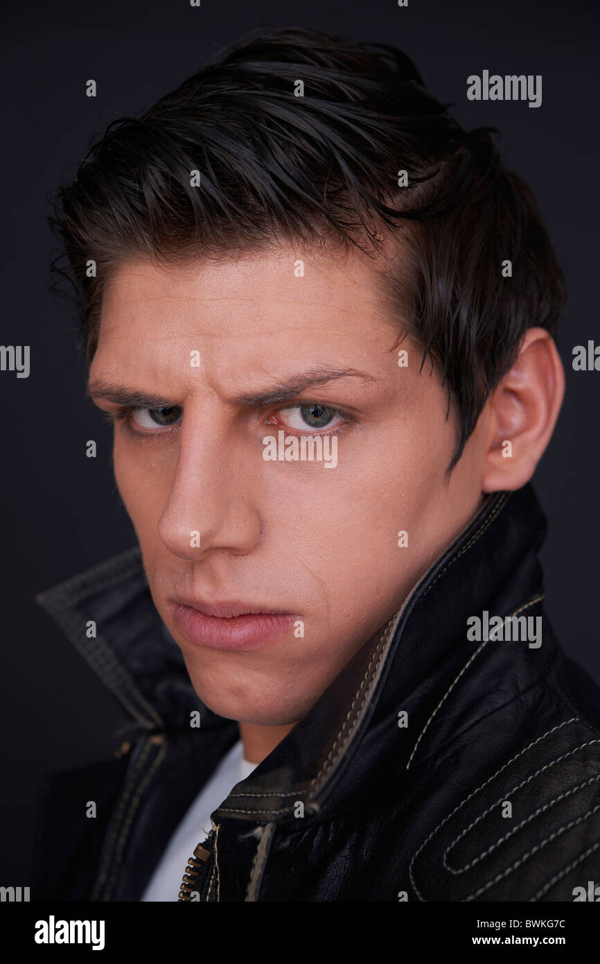 Portrait of confident young man wearing a leather jacket hi-res stock ...
