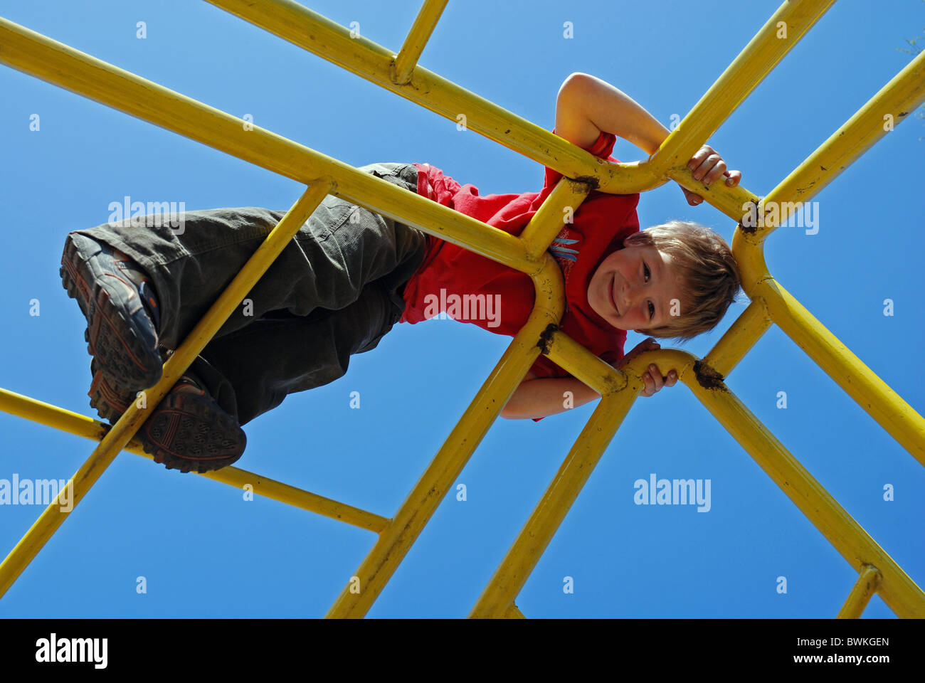 boy child boy Seven-year-old climbing scaffolding climbing scaffolding ...