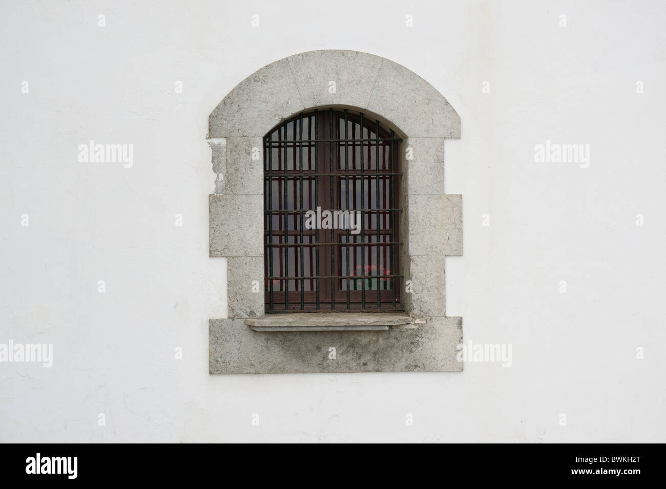 Antique window with bars and stone cill Stock Photo - Alamy