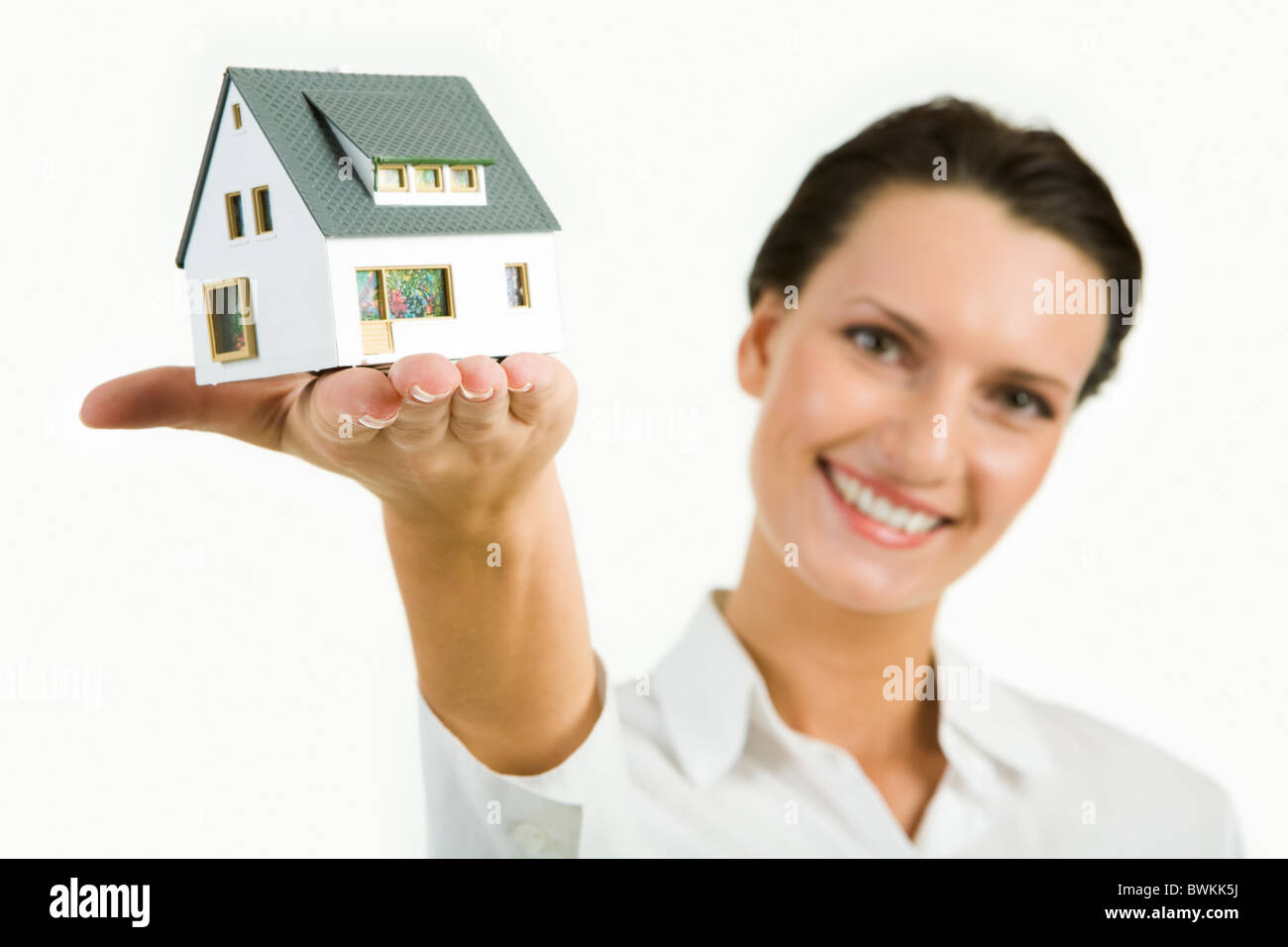 Image of young beautiful woman presenting model of house Stock Photo ...