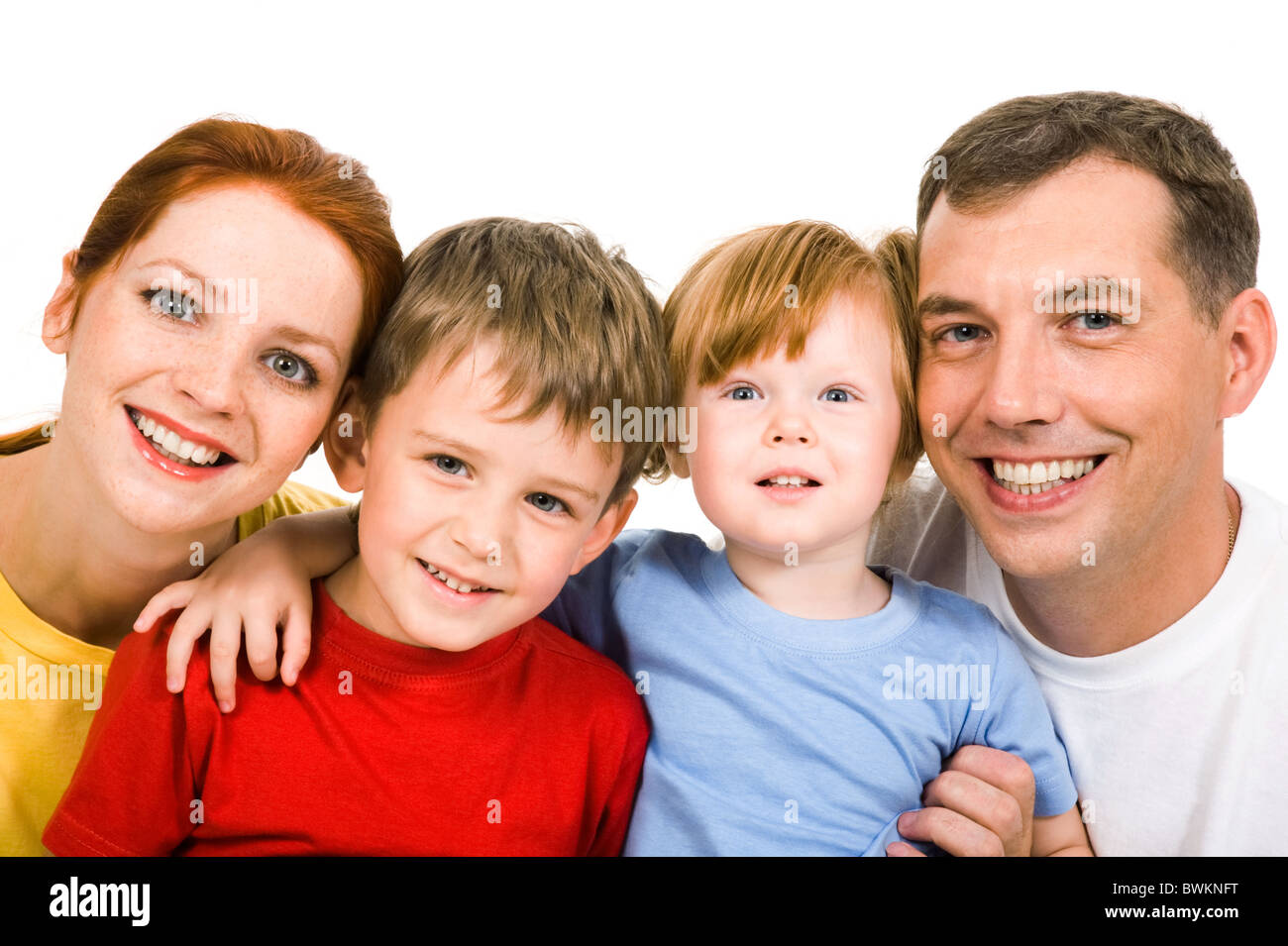 Portrait of cheerful parents with their two children on a white ...