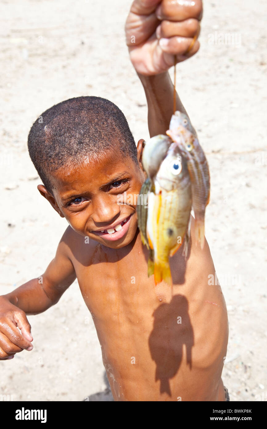 Boy and his fish, Pate Island off of Lamu Island, Kenya Stock Photo - Alamy