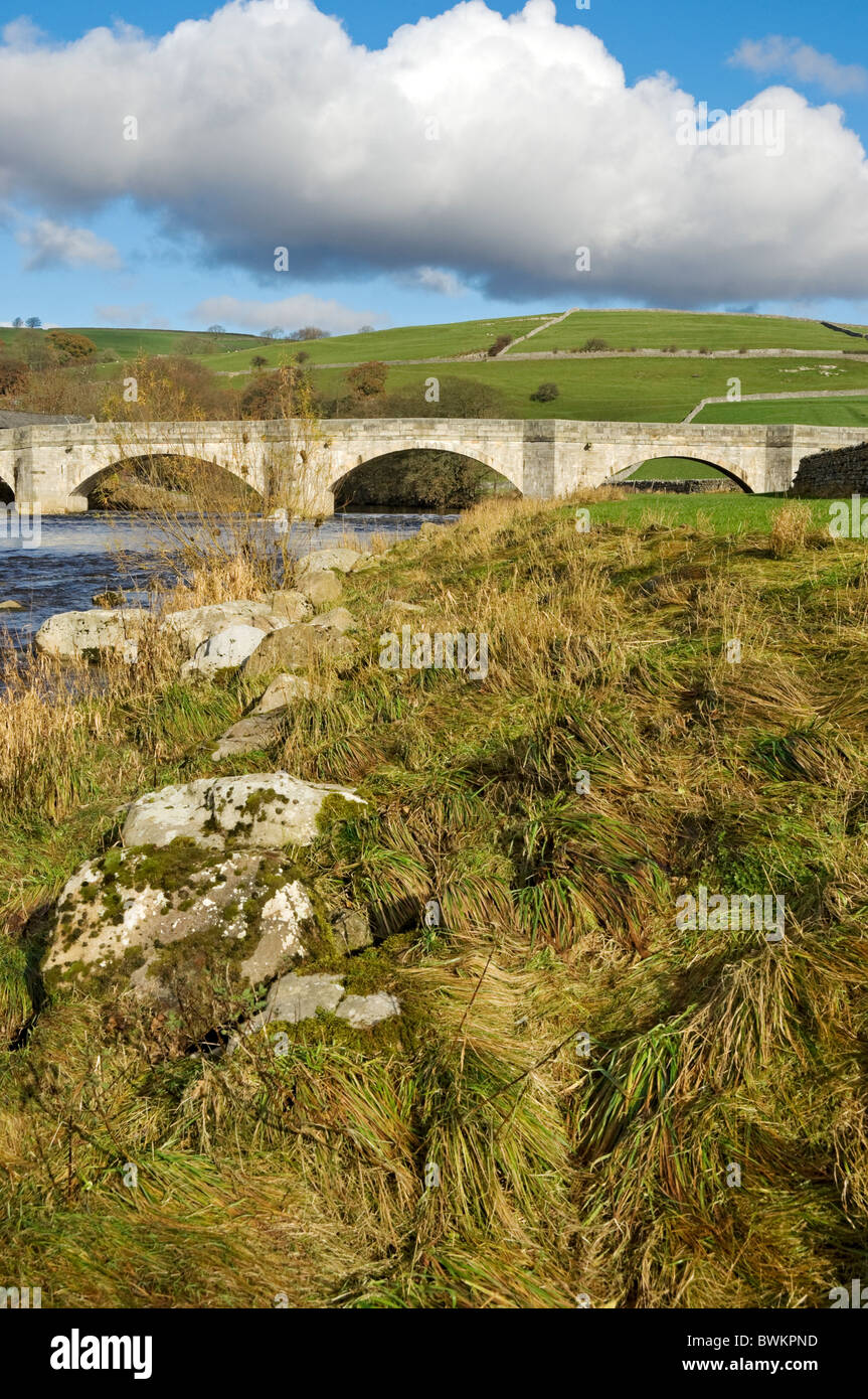 Bridge across River Wharfe in autumn winter Burnsall Lower Wharfedale ...