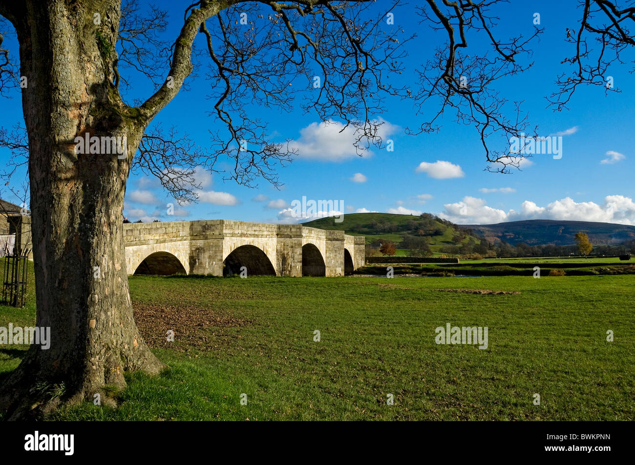 Bridge across River Wharfe in autumn winter Burnsall Lower Wharfedale ...