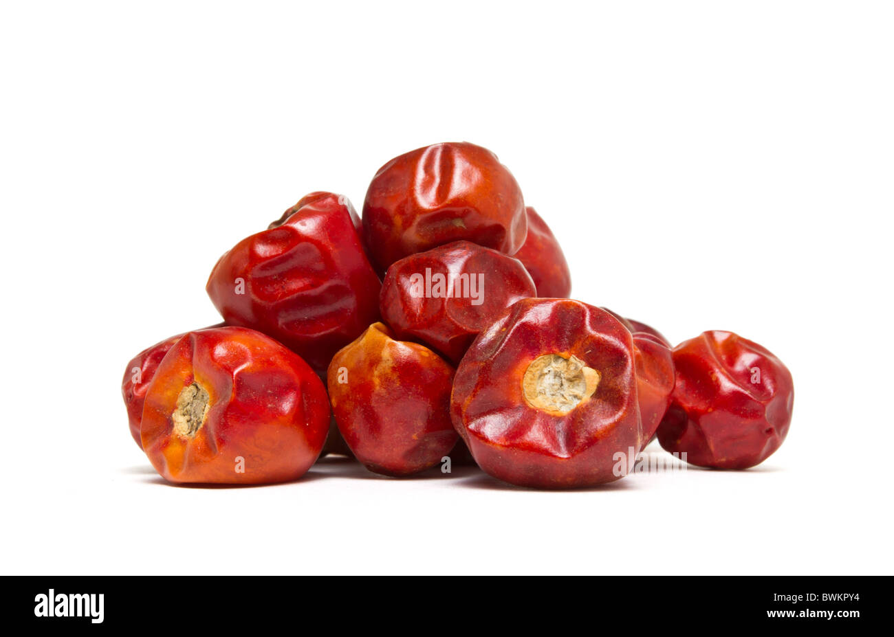 Dried whole round Chilli's from low perspective isolated on white Stock ...