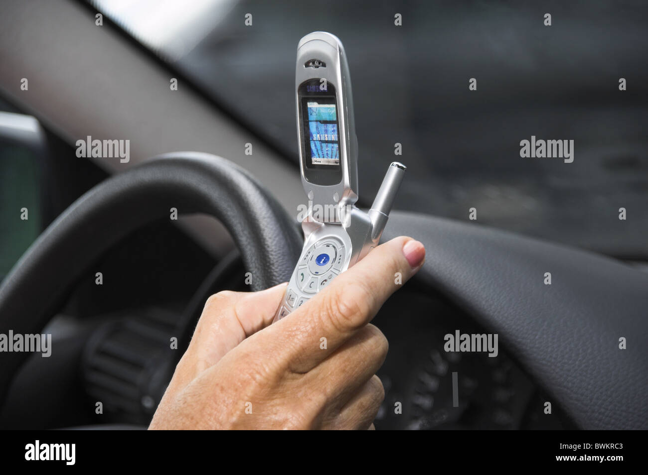 phoning mobile phone mobile phone hand steering wheel driving motoring ...
