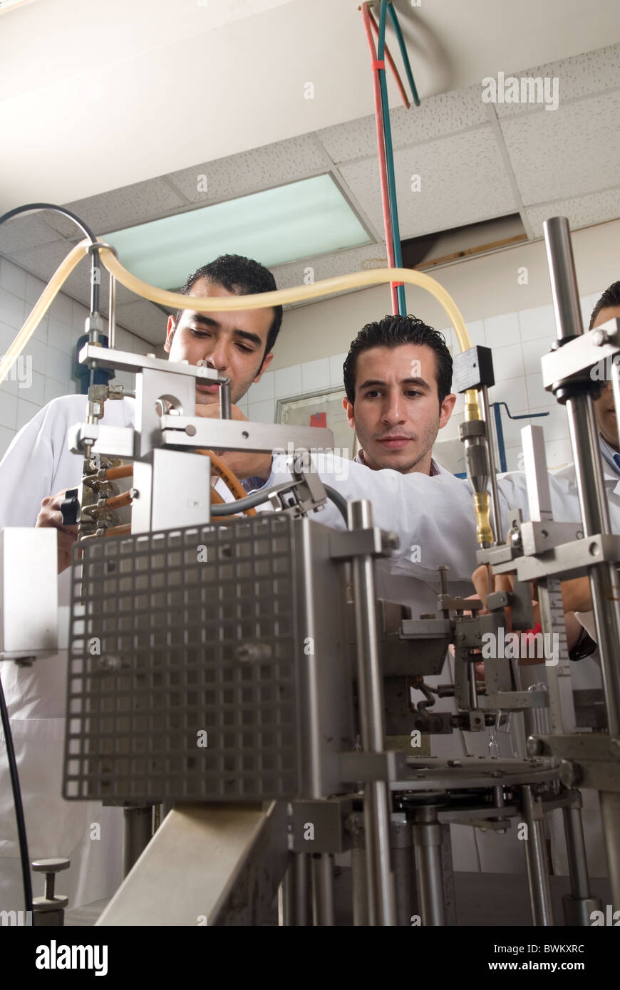 Students working on a medical machine inside a laboratory at the Beirut ...