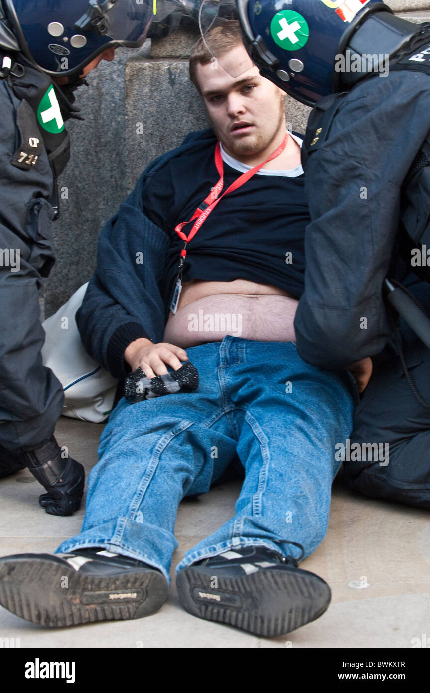 Police officers first aid medics check a collapsed boy man youth at the ...