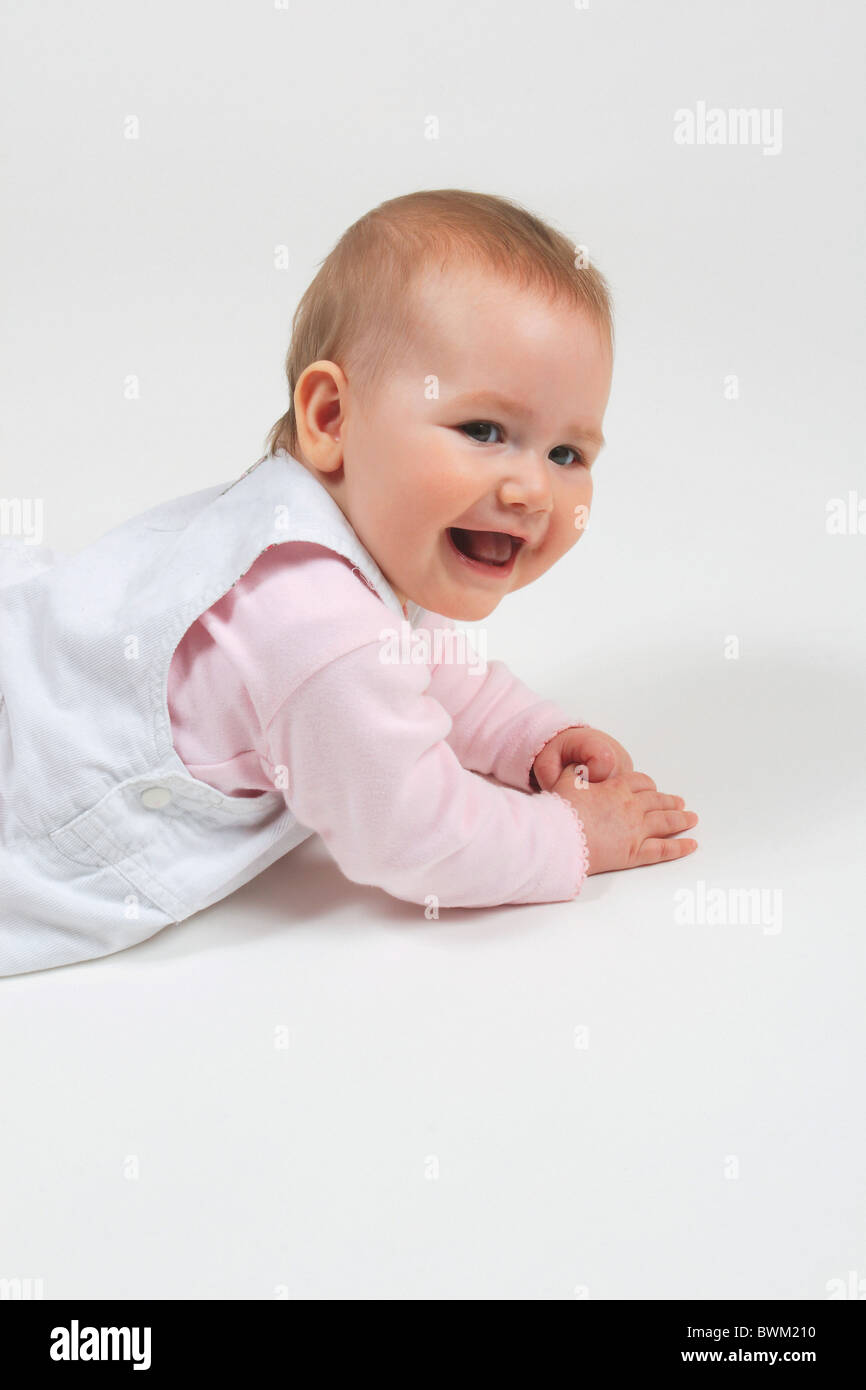 Baby Lying on tummy Smiling Studio shot Stock Photo - Alamy