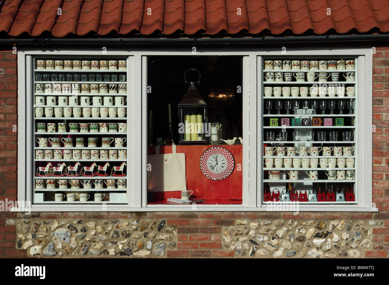 An attractive shop window, displaying perfectly arranged pottery, in ...