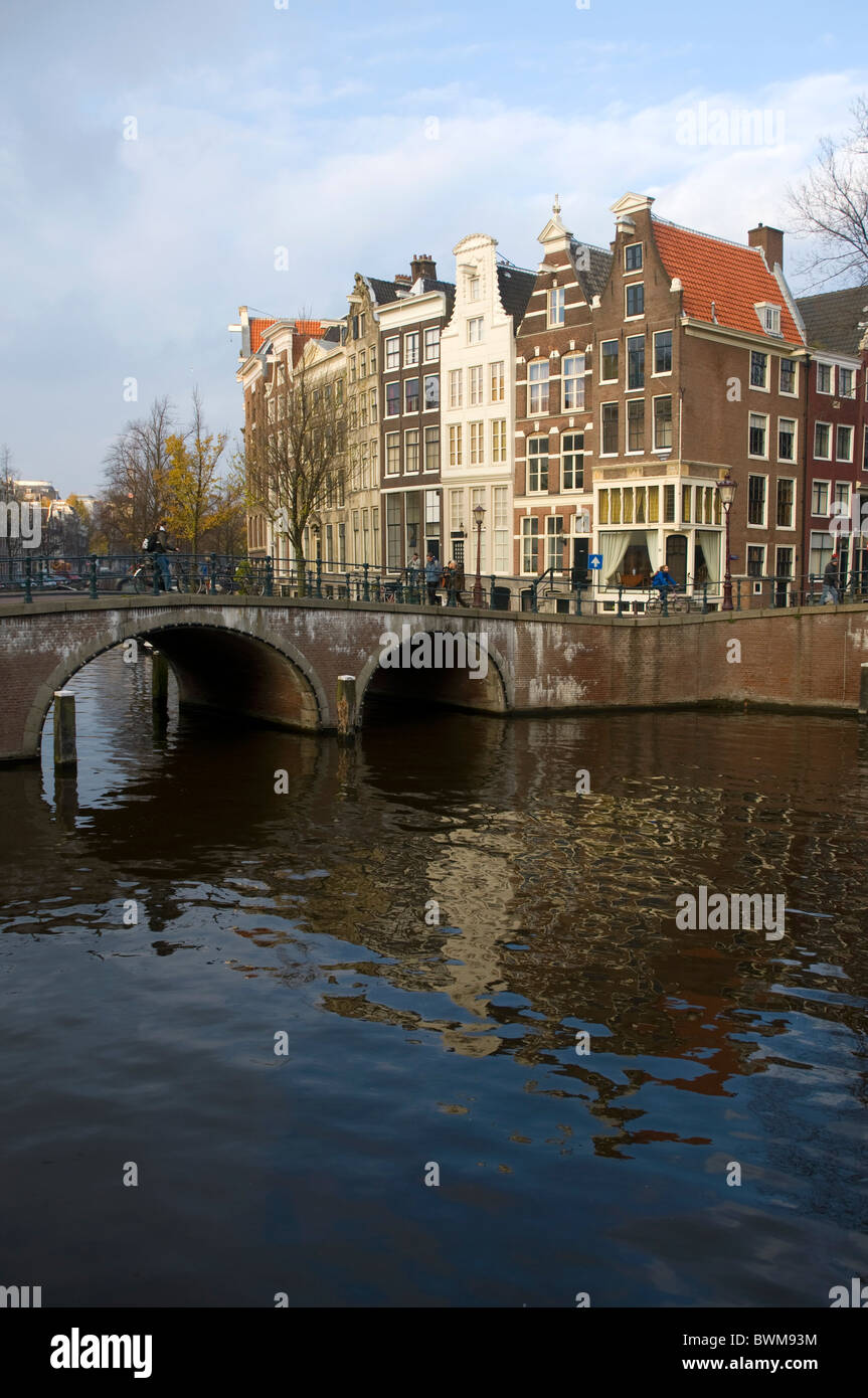 Canal scene with houses and shops, Amsterdam Stock Photo - Alamy