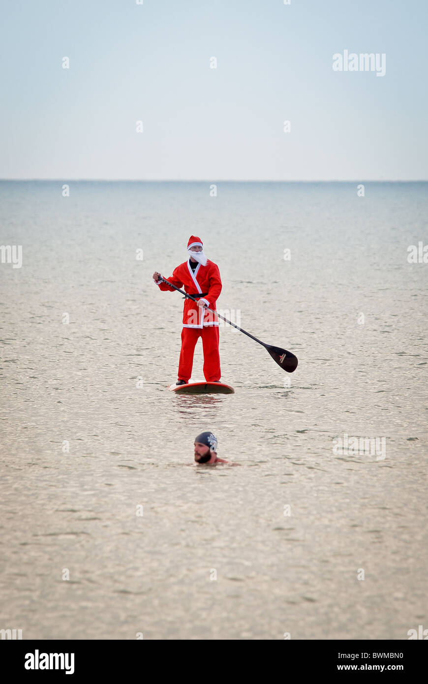 A Santa Clause take to the sea on a mild & calm Christmas Day Swim ...