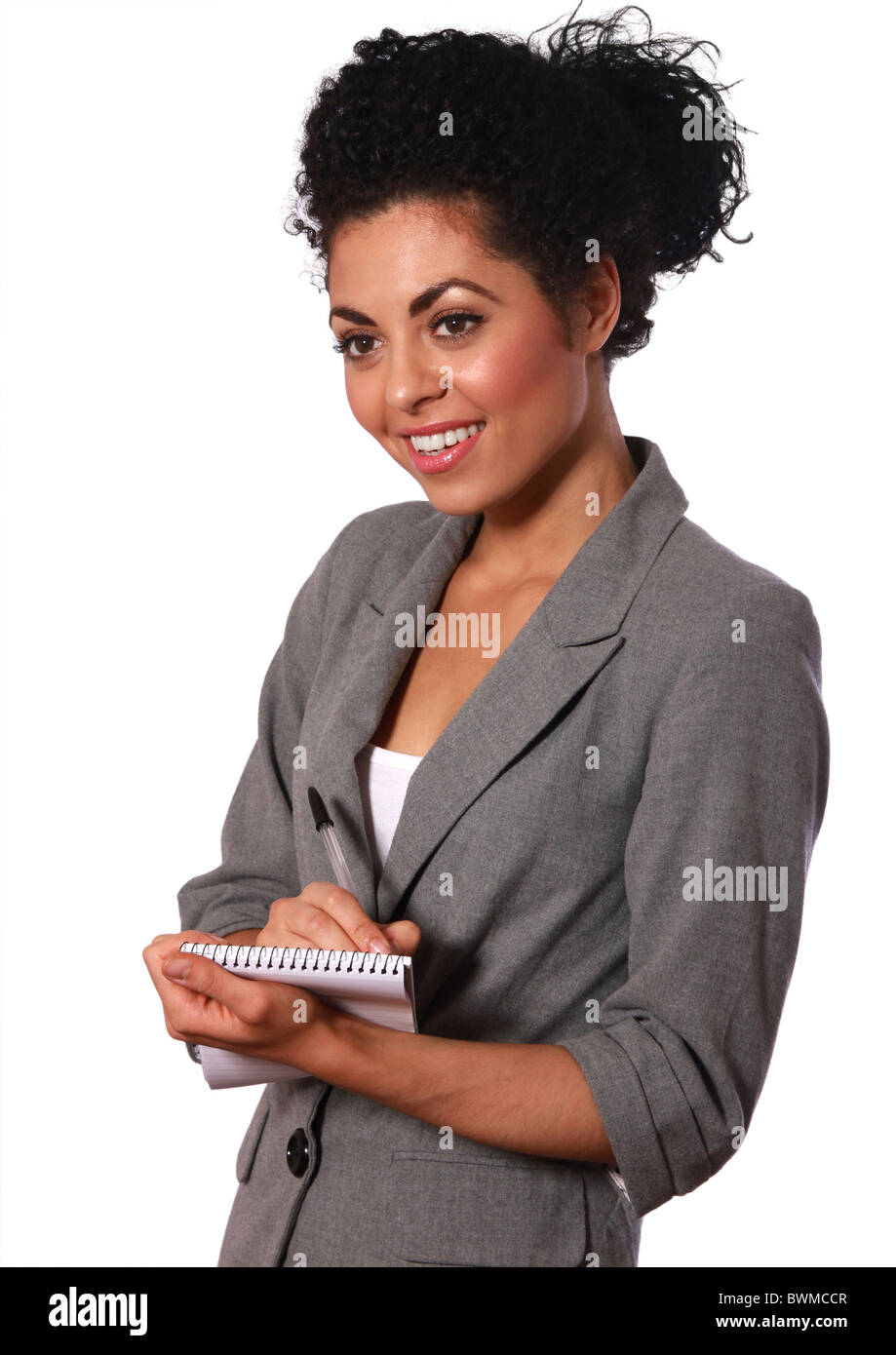 Young, mixed-race, business woman taking notes Stock Photo - Alamy