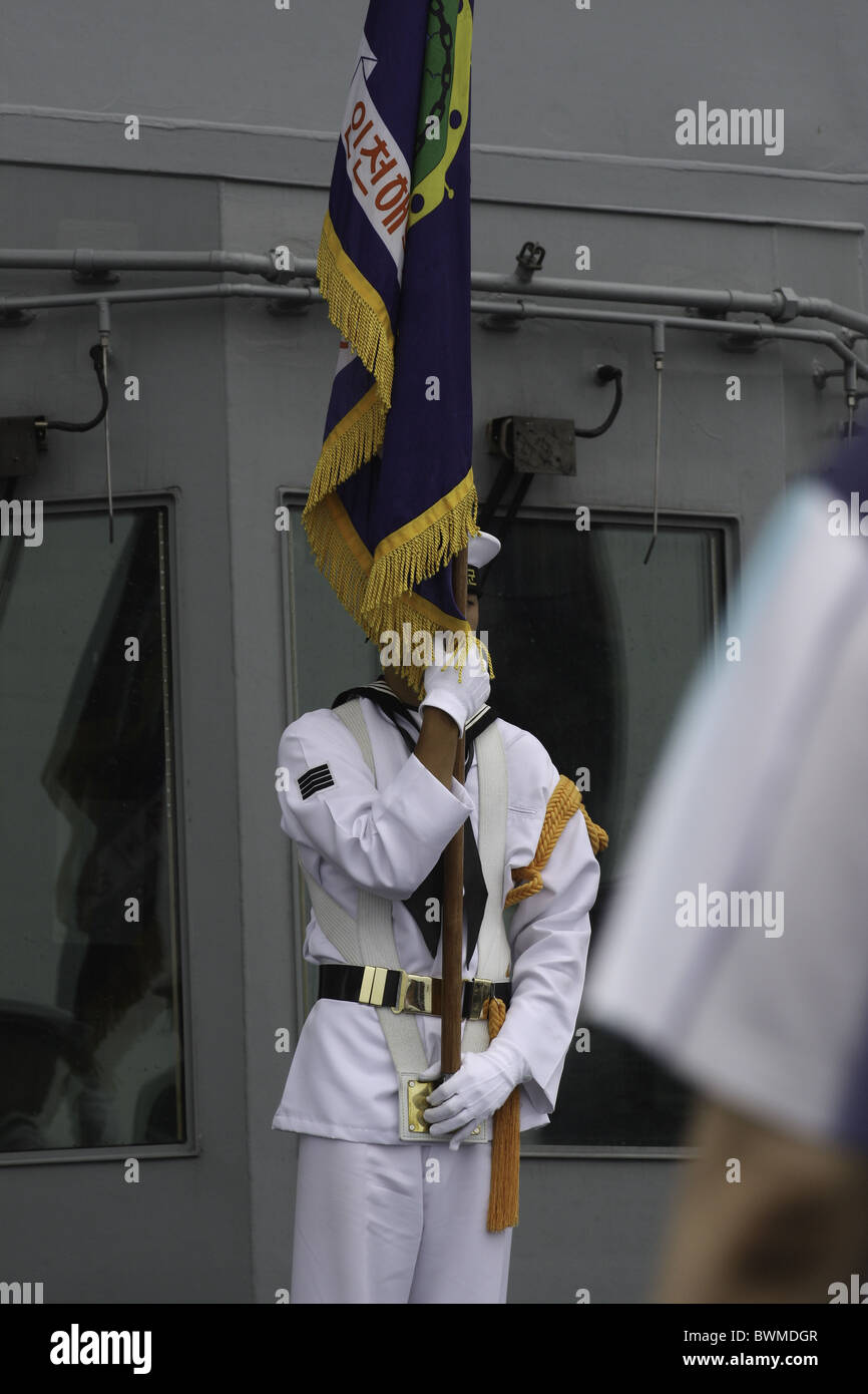 Korean Navy Soldier with Flag and Parade Uniform Stock Photo - Alamy