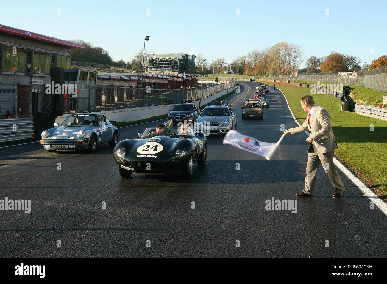 Nigel Mansell flags away the grid for the start of the 2010 Beaujolais ...