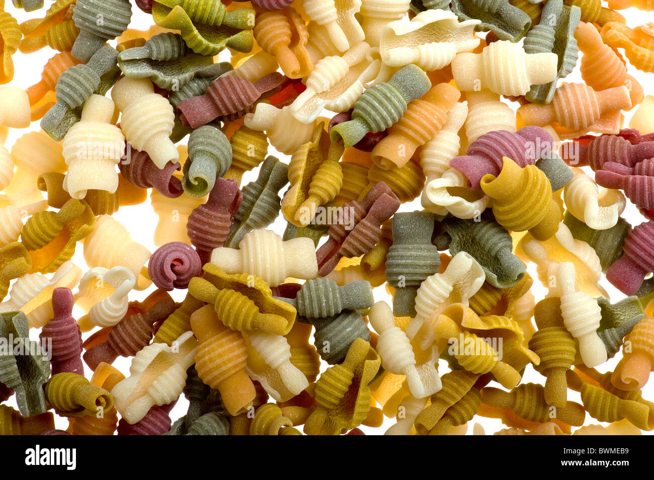 object on white - food colored pasta close up Stock Photo - Alamy