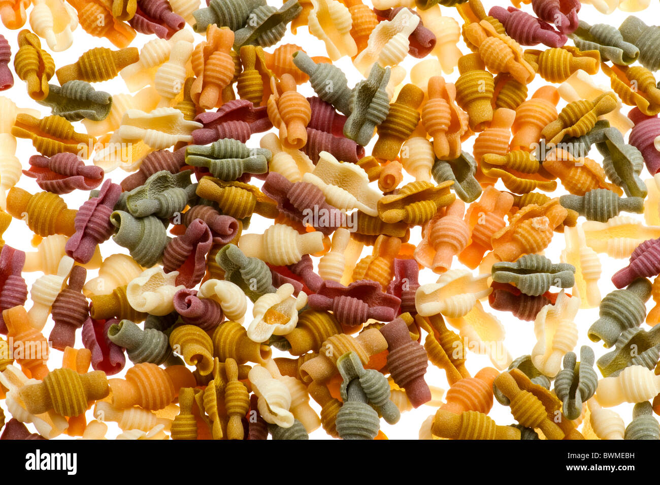 object on white - food colored pasta close up Stock Photo - Alamy