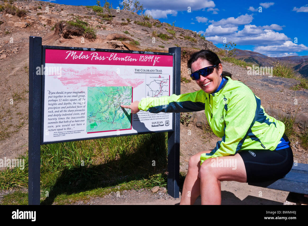 Cyclist and Molas Pass sign on the San Juan Skyway (Highway 550), San ...