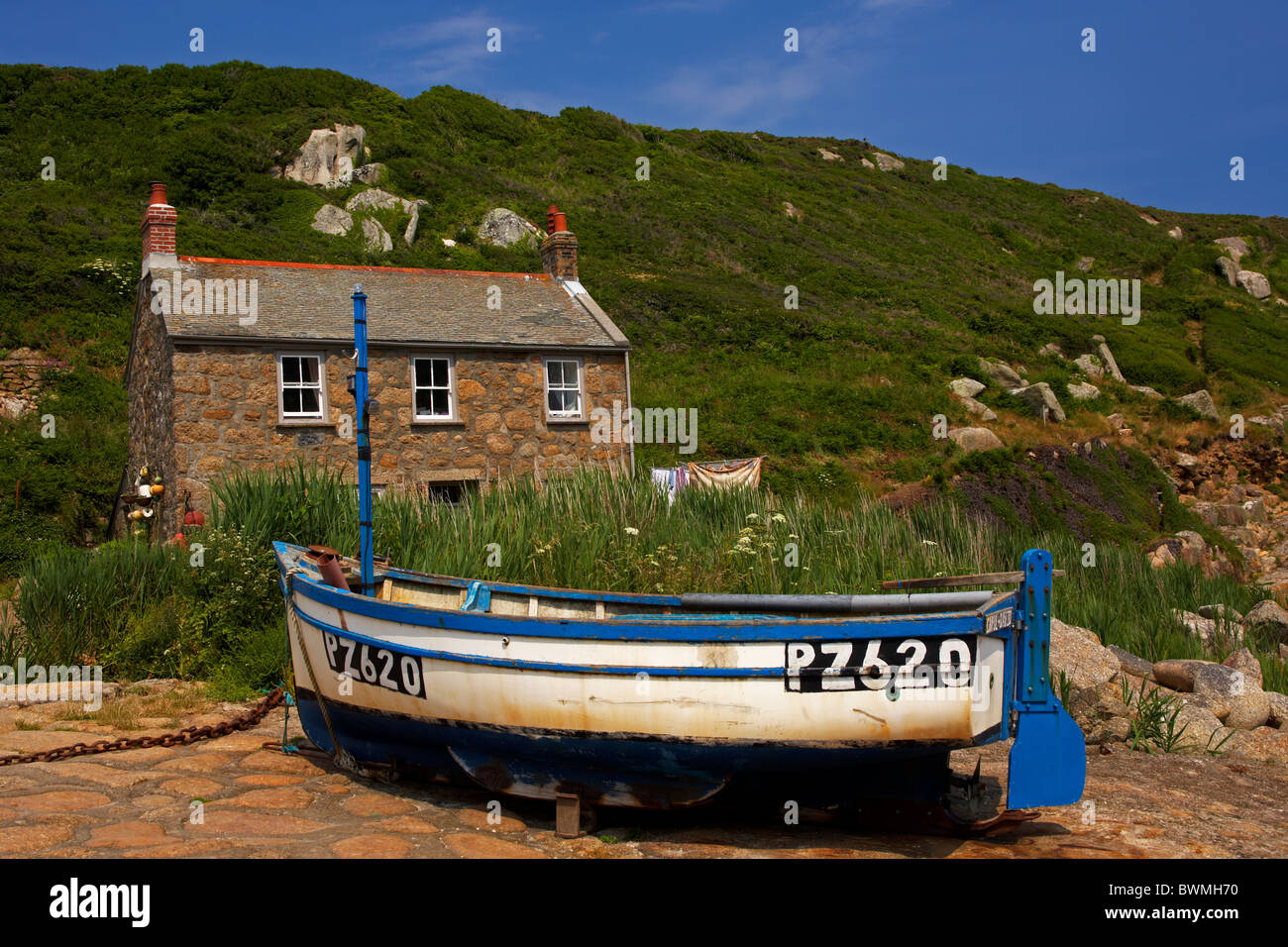 Fishing boat on the old cobbled slipway at Penberth cove on the Cornish ...