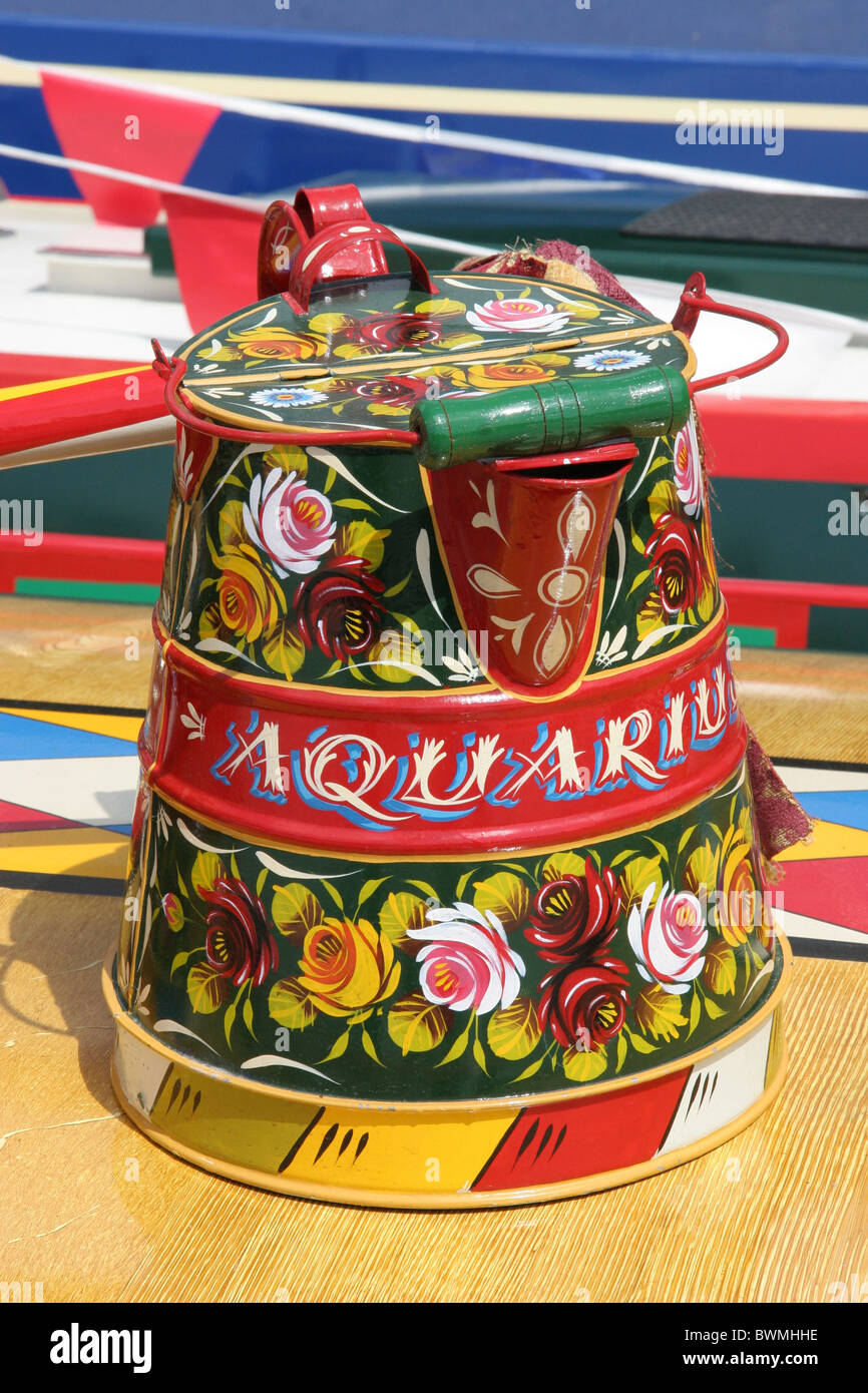 two decorated buckby can traditionaly painted with castles and roses ...