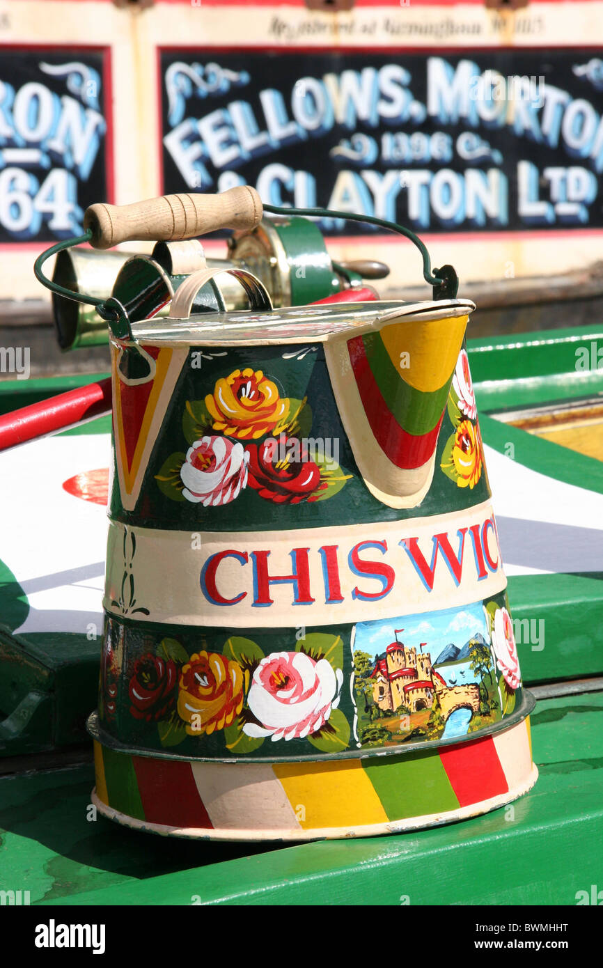a decorated buckby can traditionaly painted with castles and roses form ...