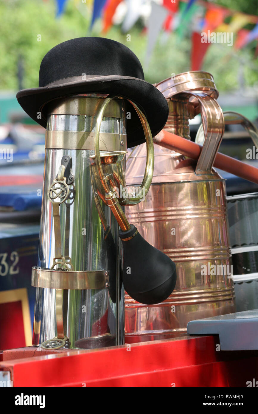 a brass buckby can and top hat on a narrowboat on the canal Stock Photo ...