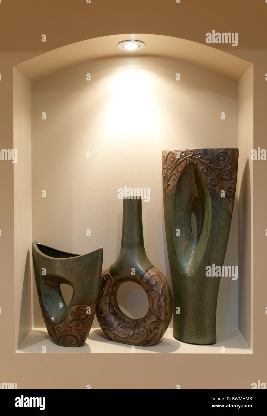 Artistic sculptures placed within a residential wall alcove Stock Photo ...