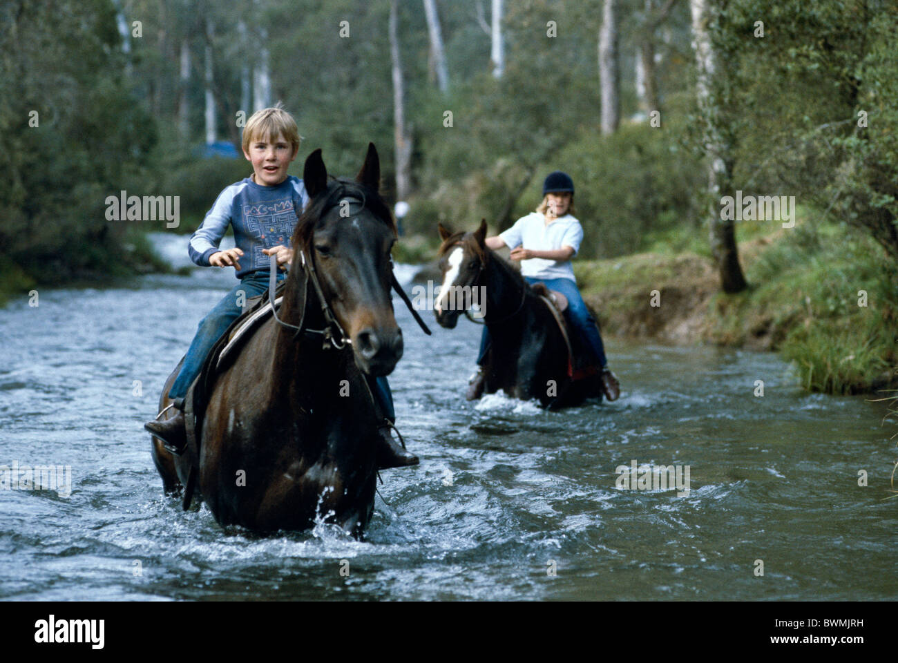 Country kids riding their ponies, Australia Stock Photo - Alamy