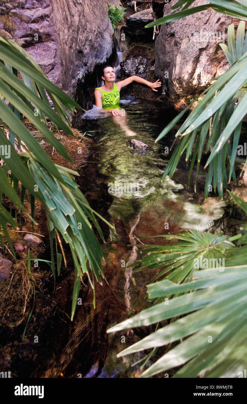 Woman relaxing in thermal spring, El Questro, Western Australia Stock ...