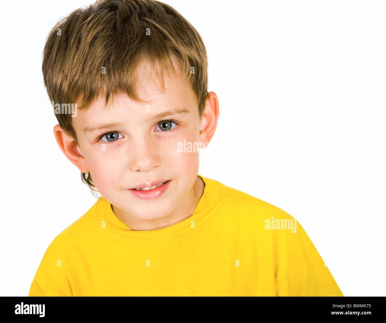 Portrait of boy in yellow shirt isolated on a white background Stock ...