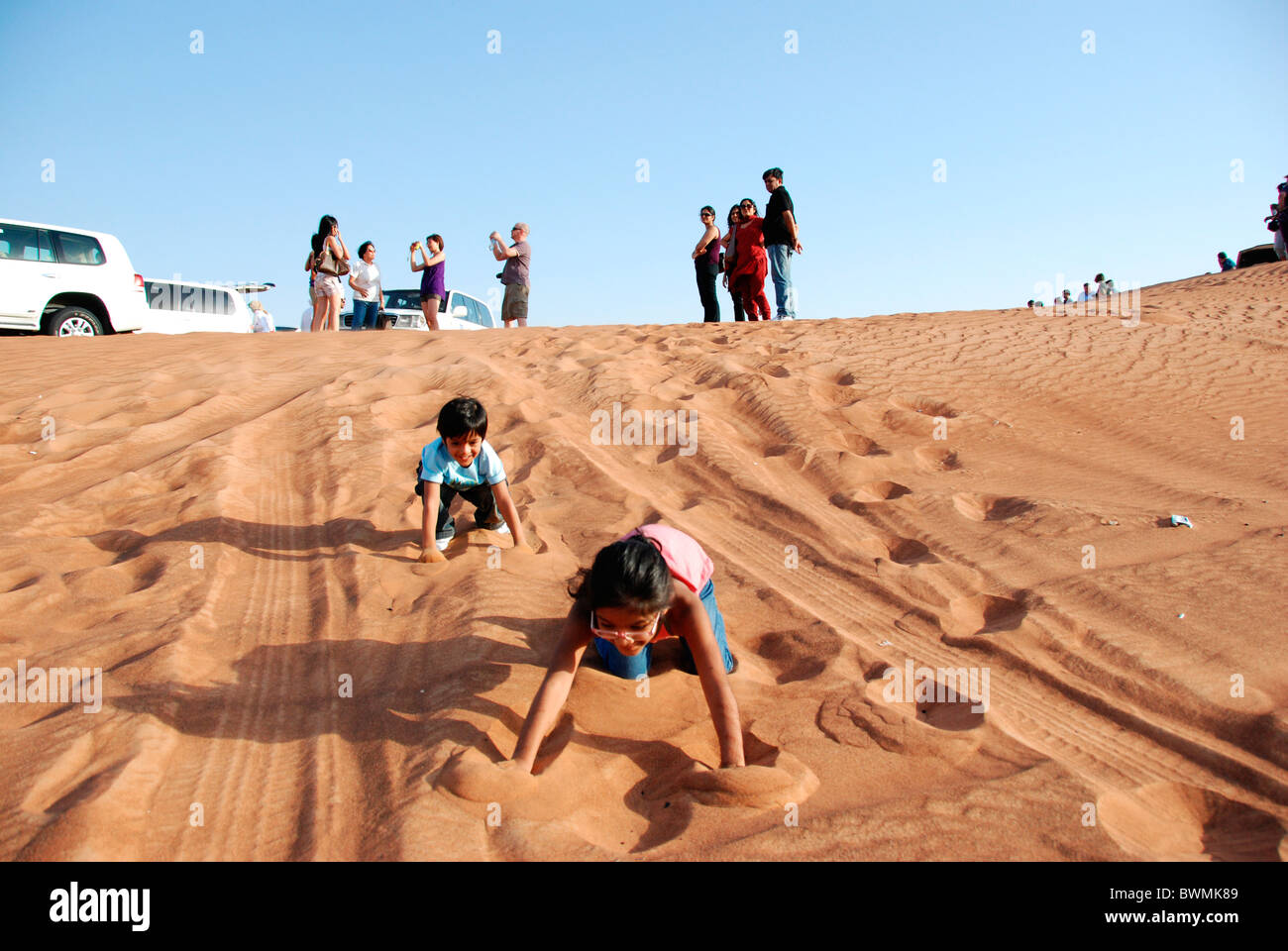 children playing on desert during desert safari,dubai Stock Photo - Alamy