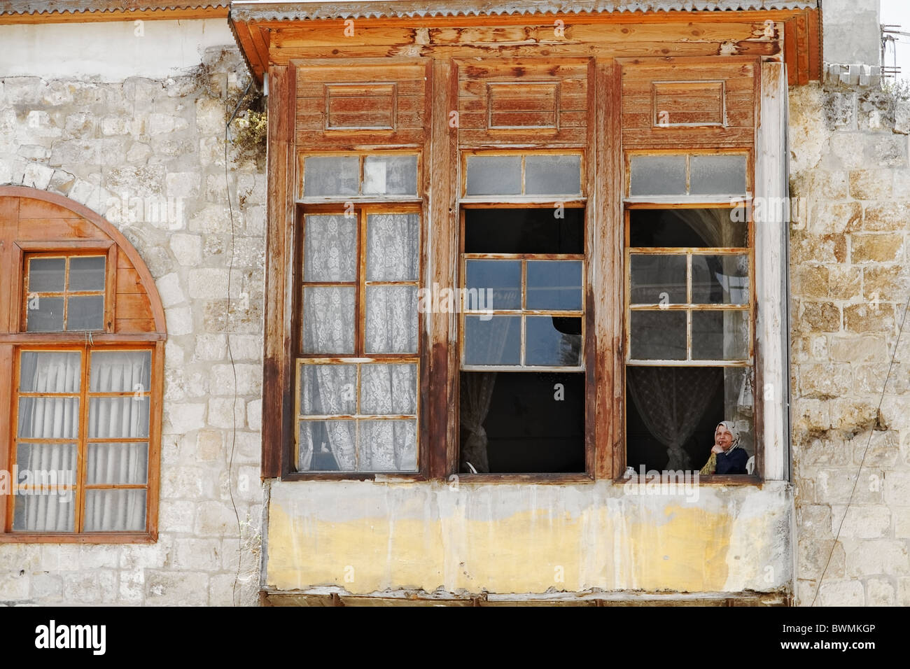 A woman smoking at her window Stock Photo - Alamy