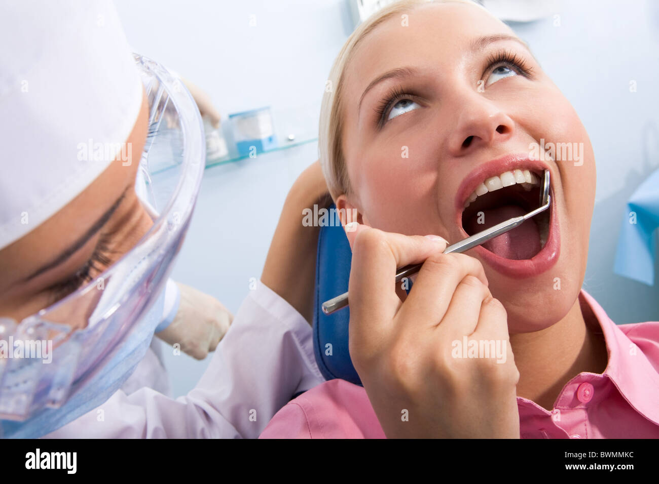 Image of young woman during inspection of oral cavity with help of ...