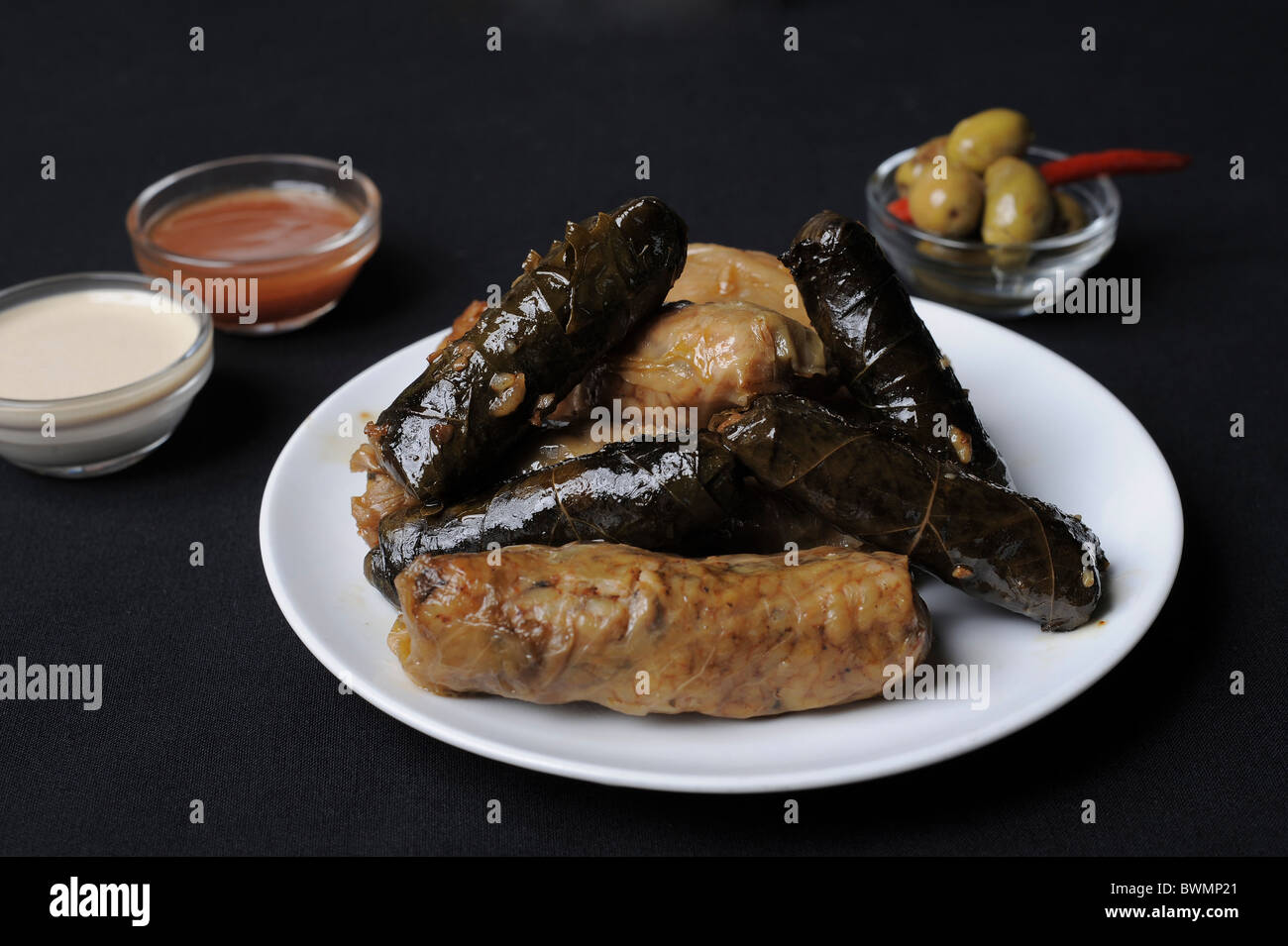 A plate with Stuffed Vine Leaves and Stuffed Cabbage Stock Photo - Alamy
