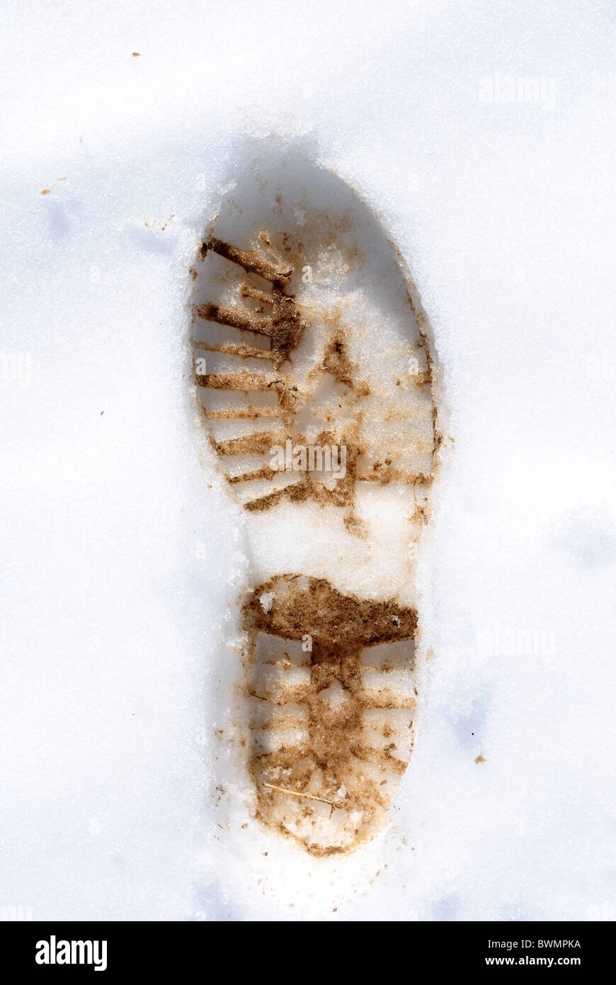 footprint in the snow mountain boot Stock Photo - Alamy