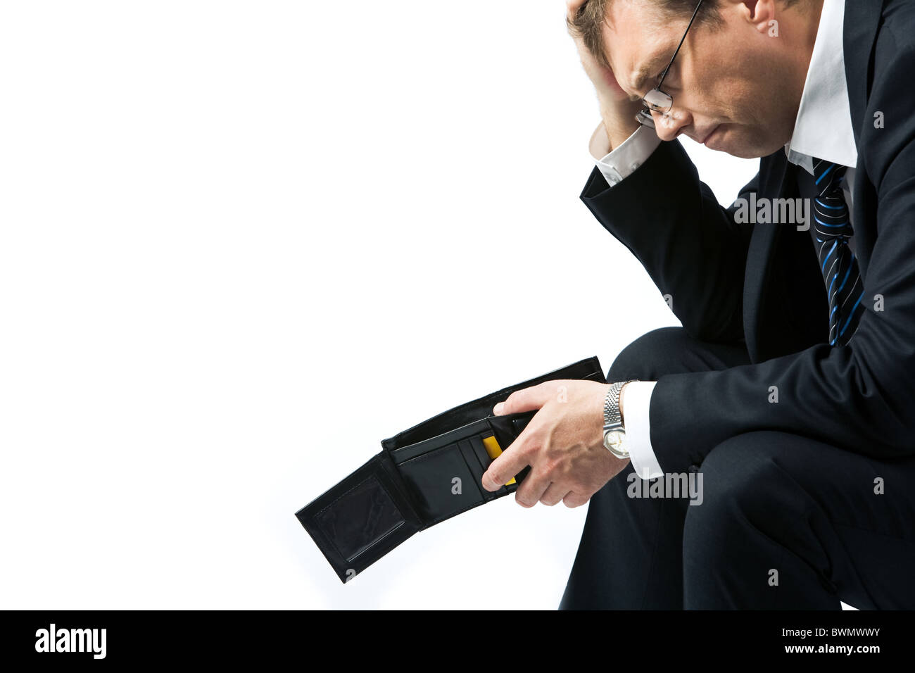 Image of sad businessman holding empty wallet and grieving Stock Photo - Alamy