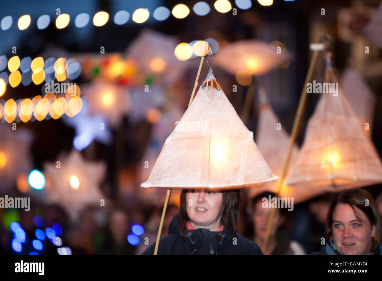 A lantern festival procession at the Christmas lights switch on in ...