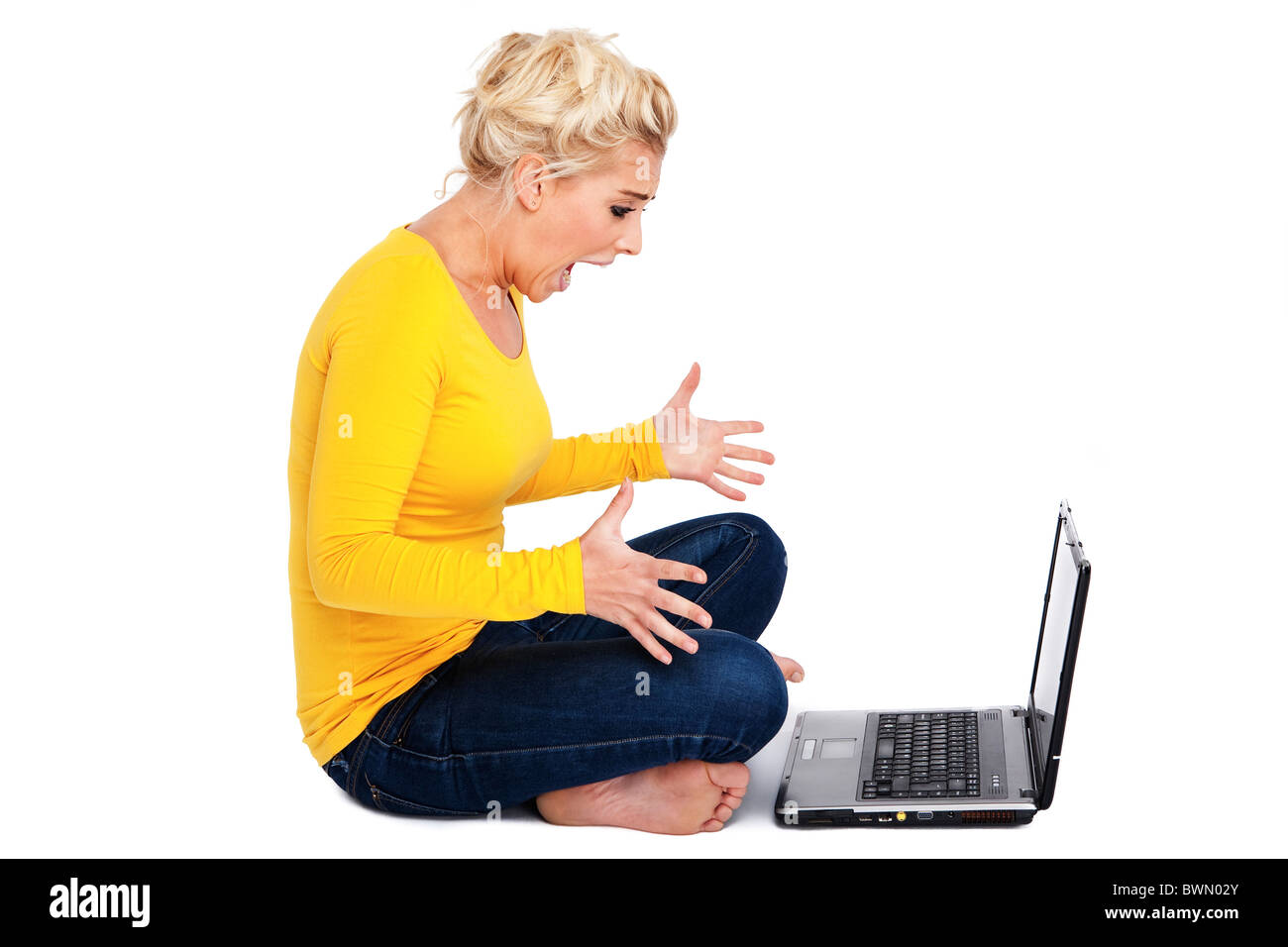 Attractive Young Woman Shouting at Laptop - Computer Crash Stock Photo ...