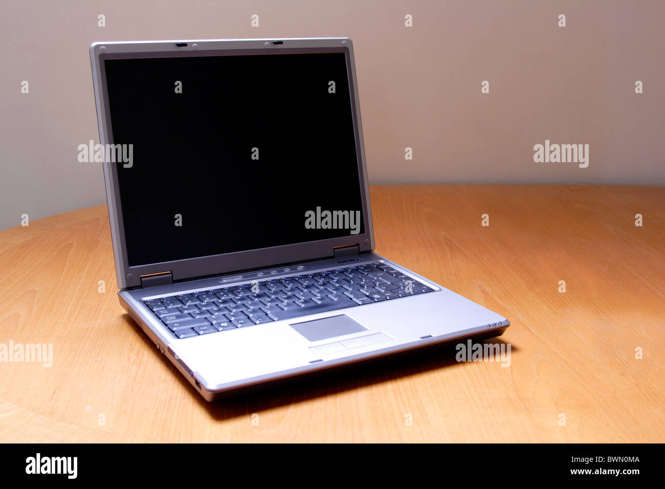 Laptop computer on wooden table Stock Photo - Alamy