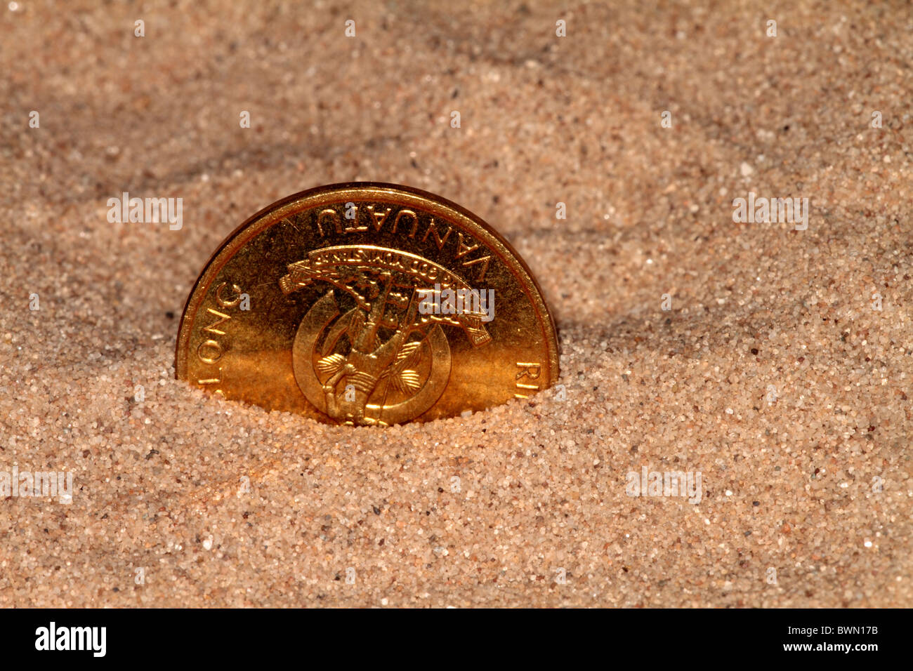 vanuatu coin in the sand Stock Photo - Alamy