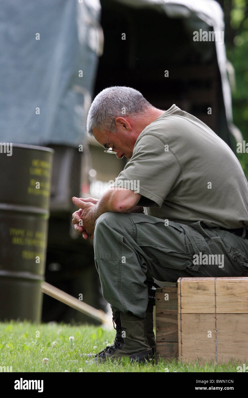 An American soldier sitting down and looking sad or depressed Stock ...