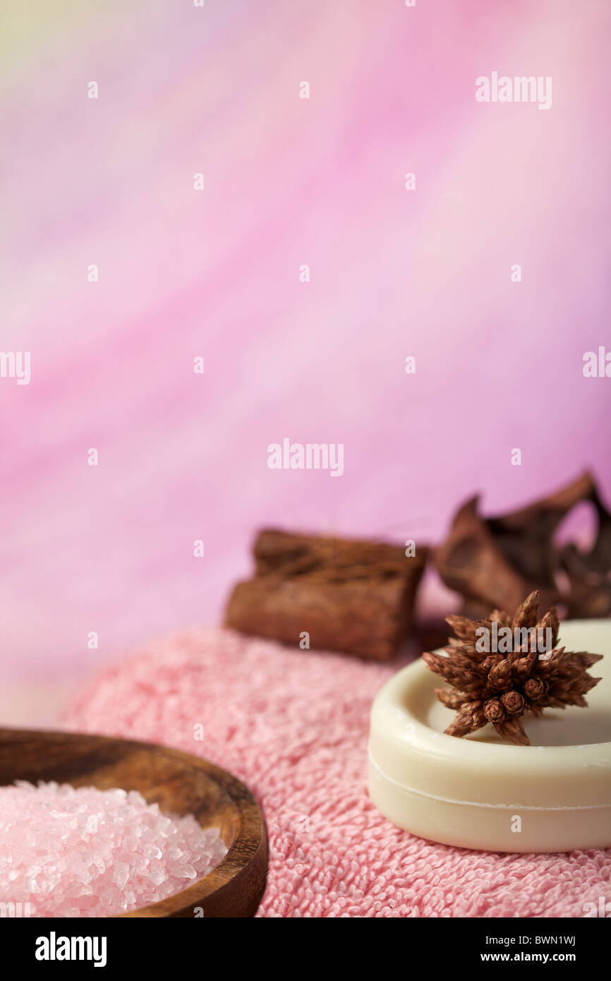 Relaxing spa treatment with body rub and rose Stock Photo - Alamy