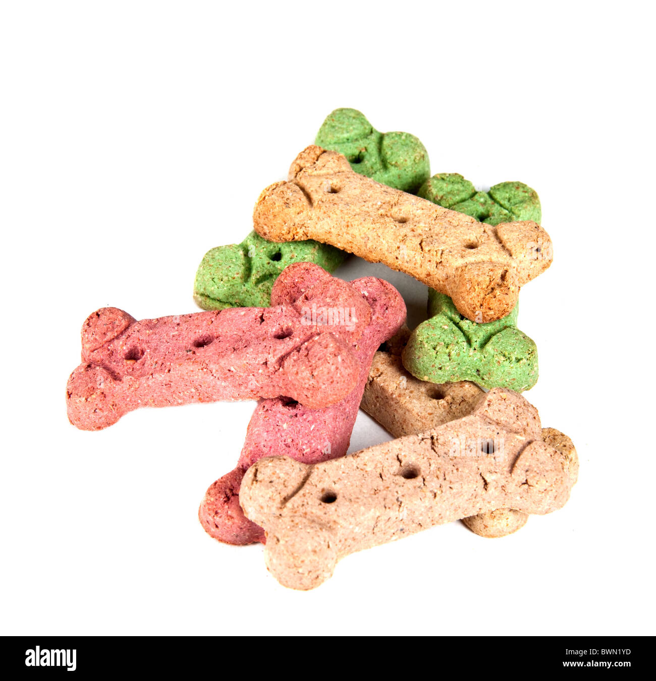 Multicolored dog treat biscuits, isolated on white Stock Photo - Alamy