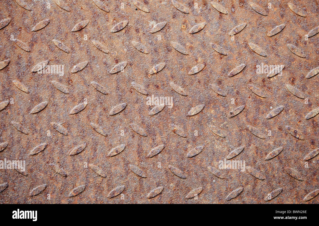Old rusty steel deck with a simple pattern - background Stock Photo - Alamy